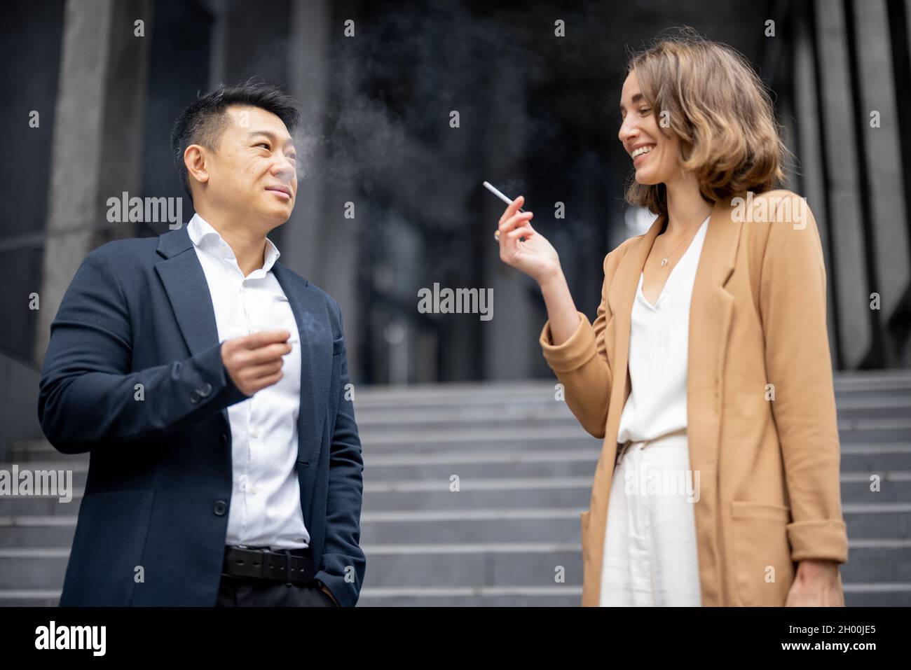 People smoking cigarettes during break at work Stock Photo - Alamy