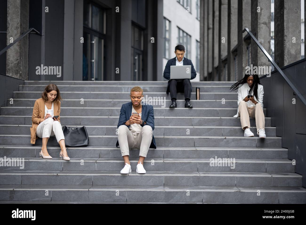 People working at distance between each other Stock Photo - Alamy