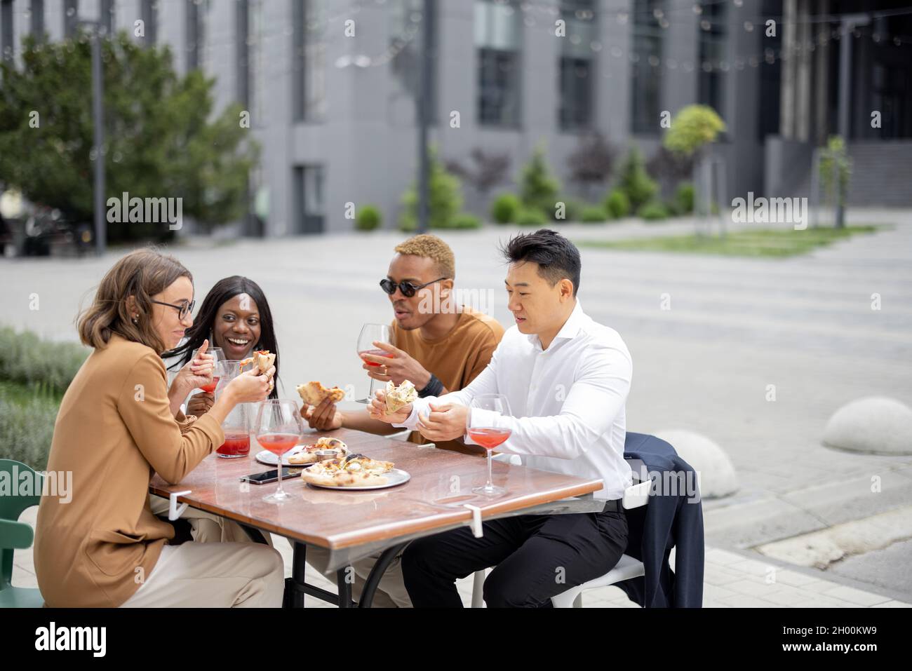 Business team having lunch at outdoor cafe Stock Photo - Alamy