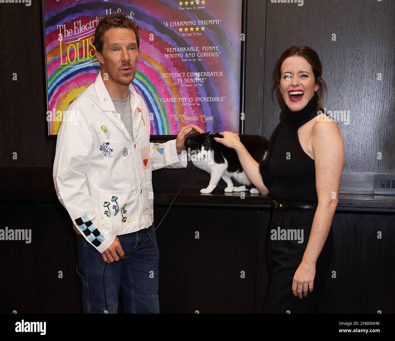 Cast members Benedict Cumberbatch and Claire Foy with Felix the cat ...