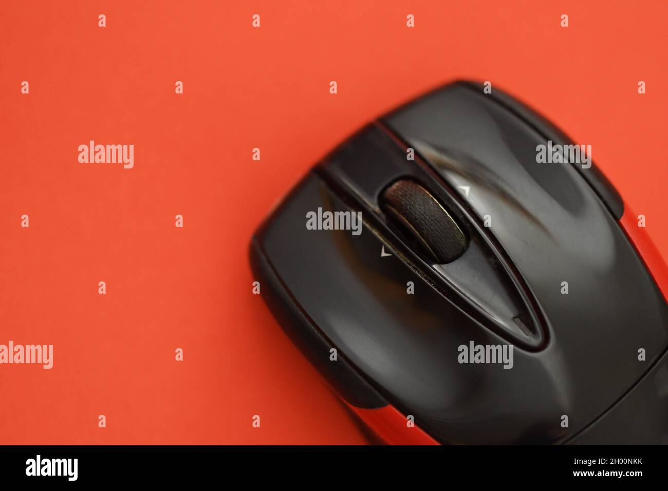 Photo of a black and red computer mouse on a red background Stock Photo ...