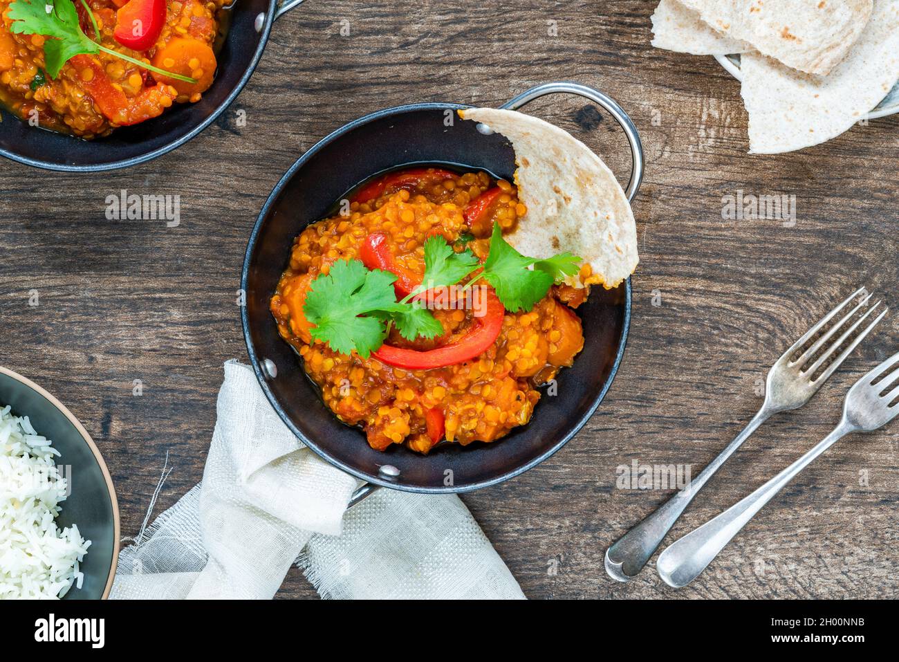 Indian vegetarian red lentil dhal curry with roti and rice - overhead ...