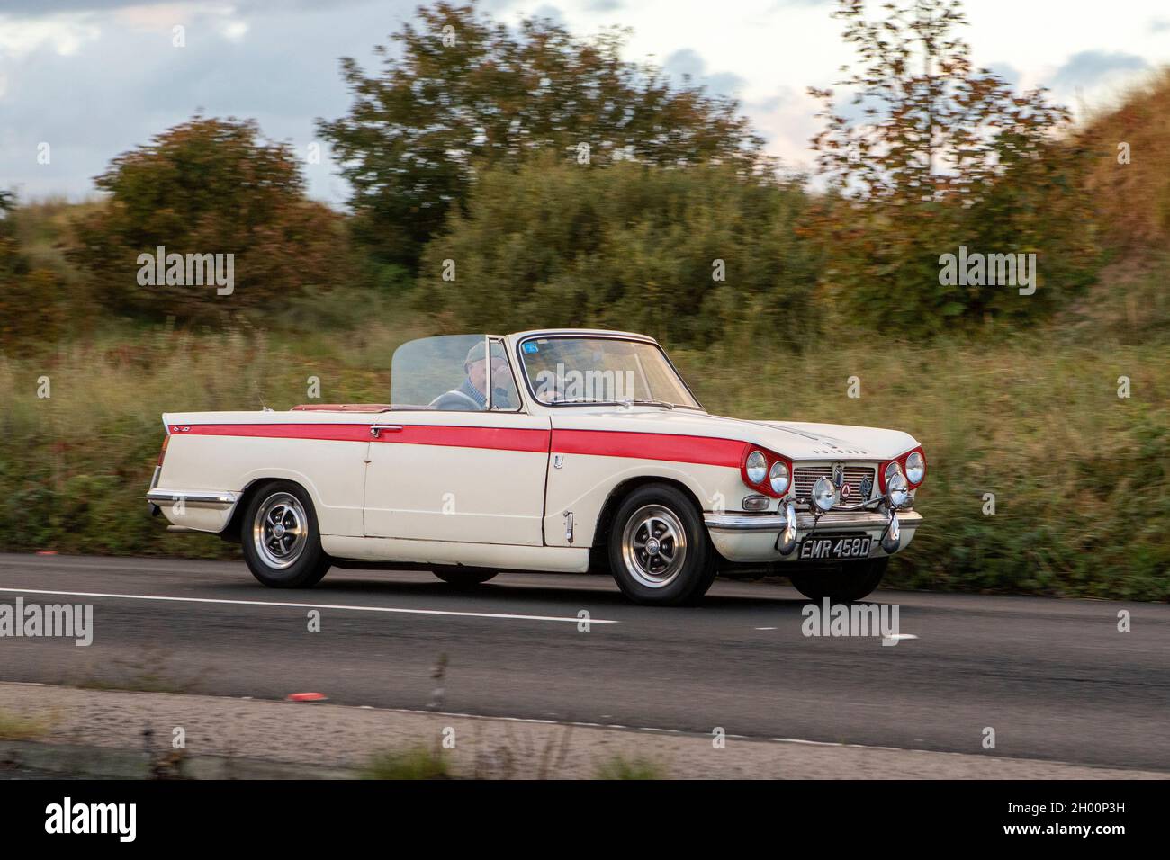 1966 60s sixties red white British Triumph Vitesse driving to Southport ...