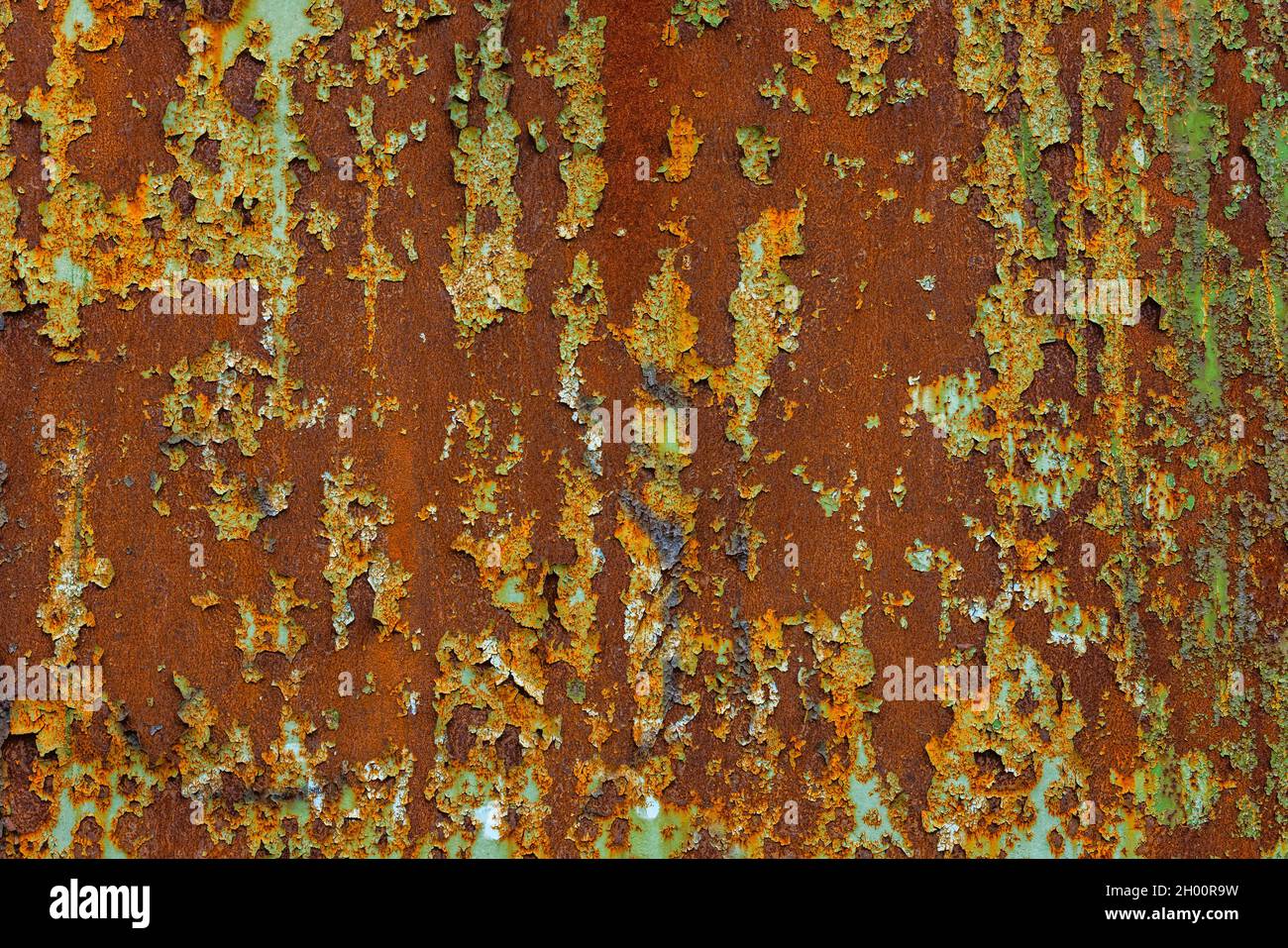 flaked off green paint on flat rusted sheet metal surface Stock Photo ...