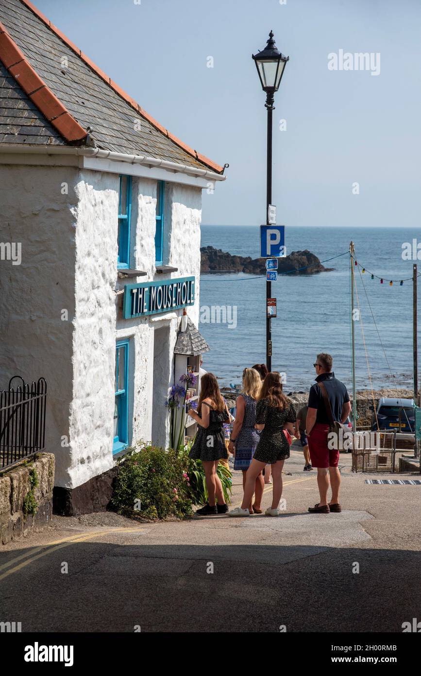 Mousehole, Cornwall, England UK. 2021. Holidaymakers shopping in the ...