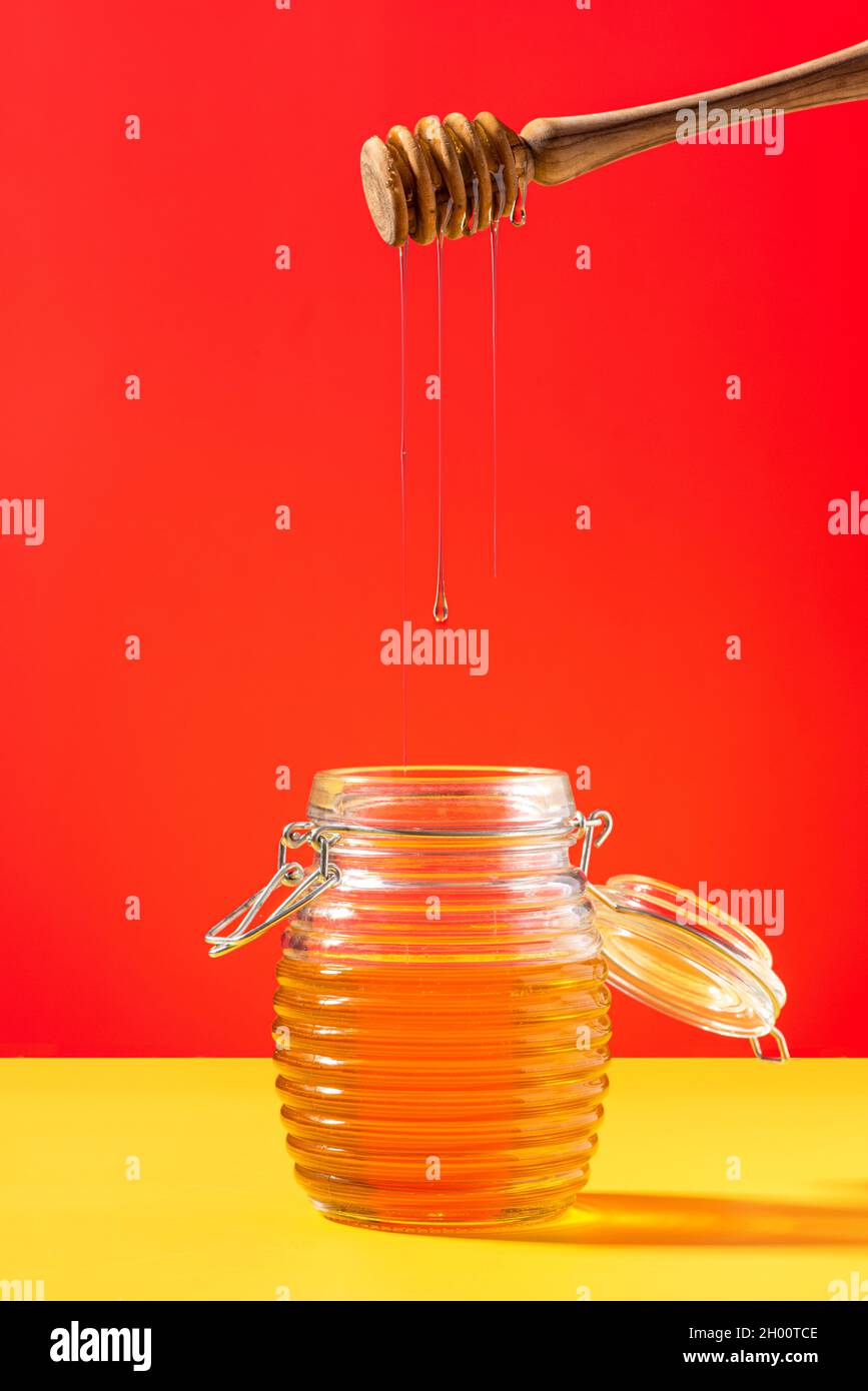 Honey Drop from Dipper into Jar. Graphic Food Studio Photo Stock Photo ...