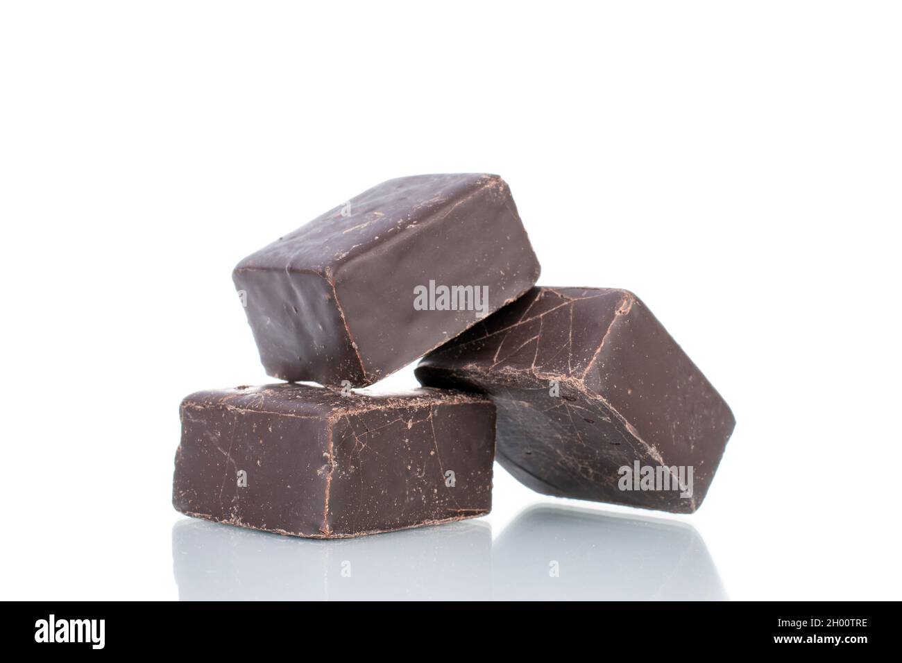 Three sweet chocolate candies, close-up, isolated on white Stock Photo ...