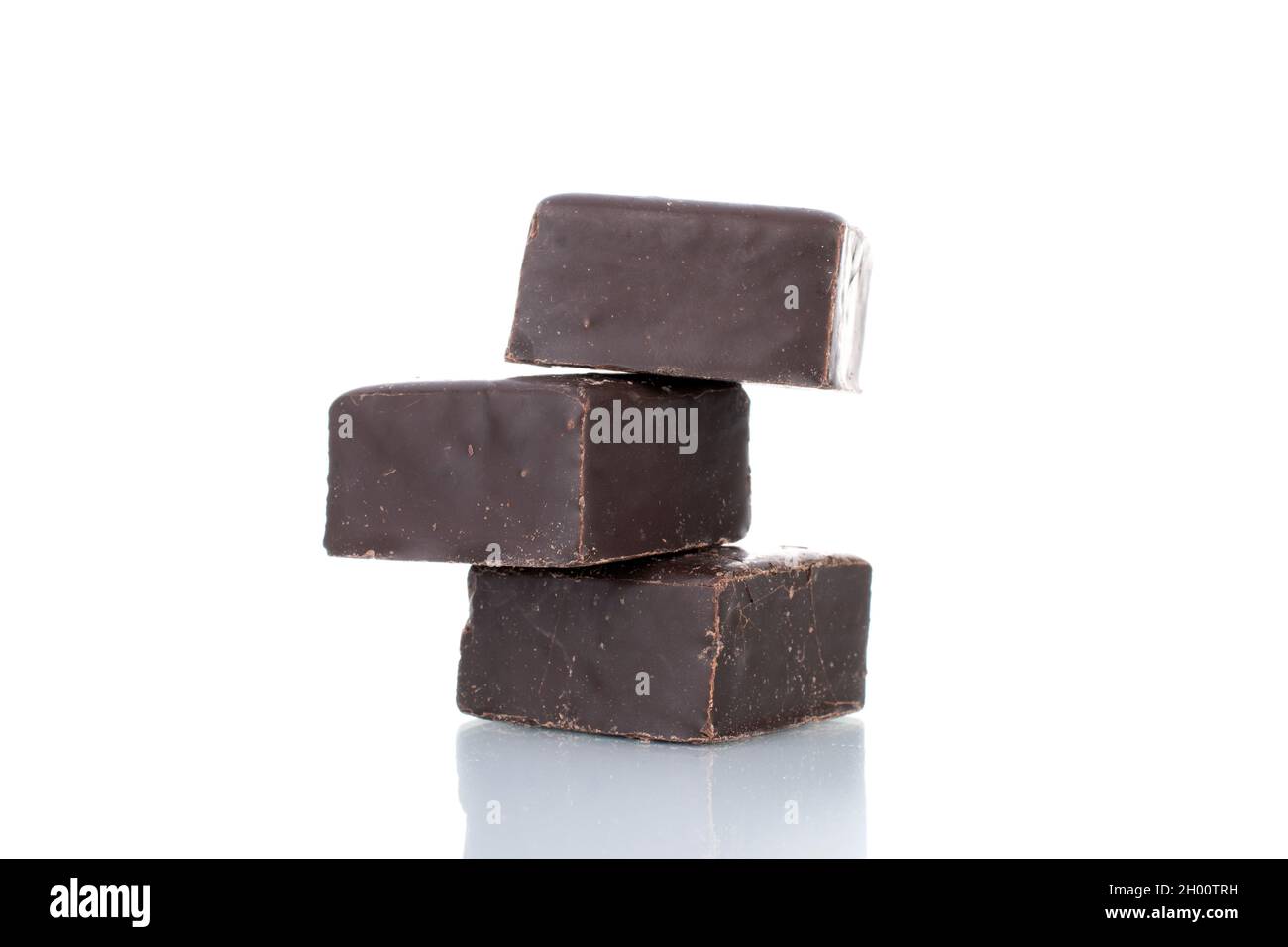 Three sweet chocolate candies, close-up, isolated on white Stock Photo ...