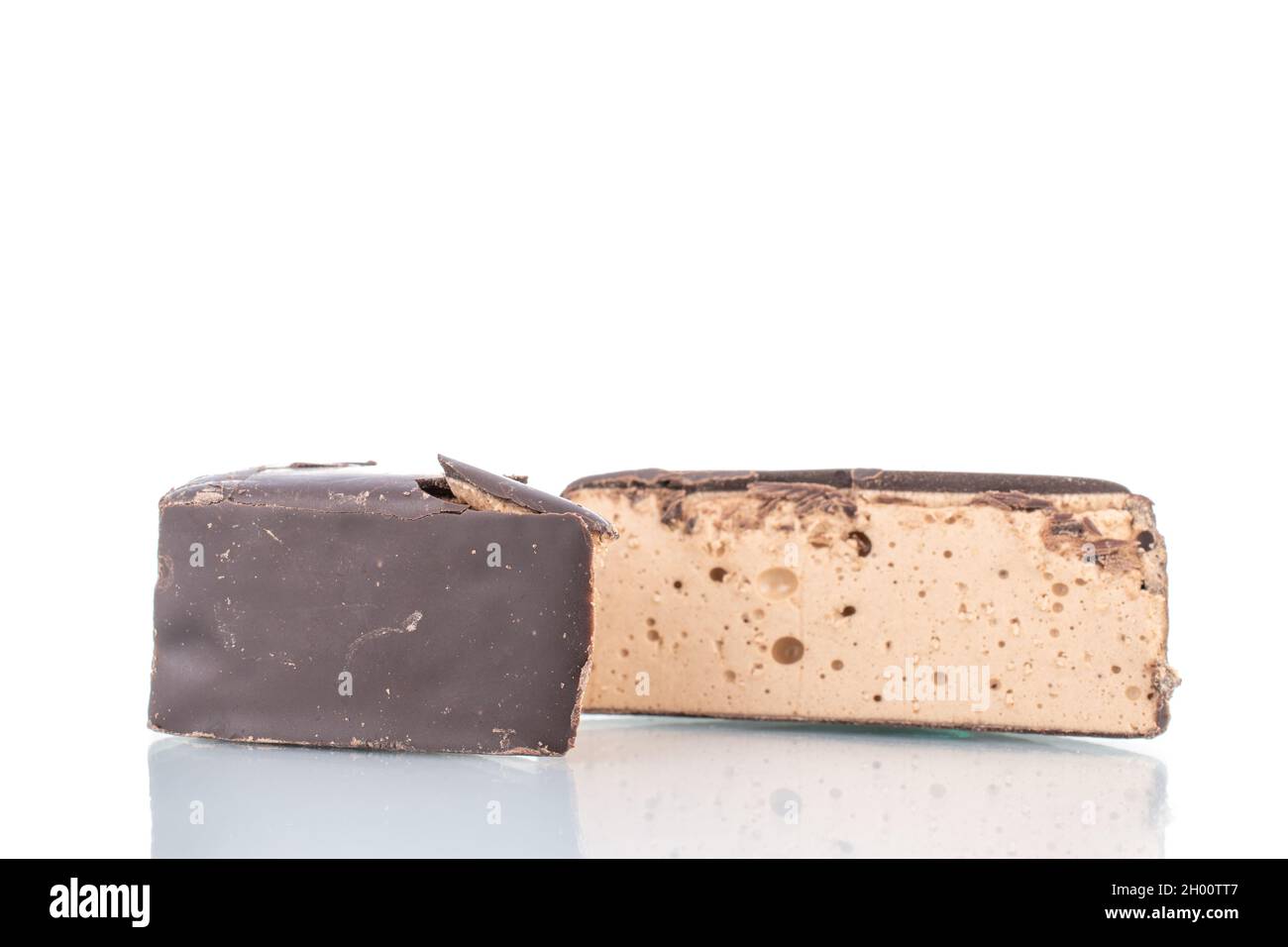 Two halves of sweet chocolate candy, close-up, isolated on white Stock ...