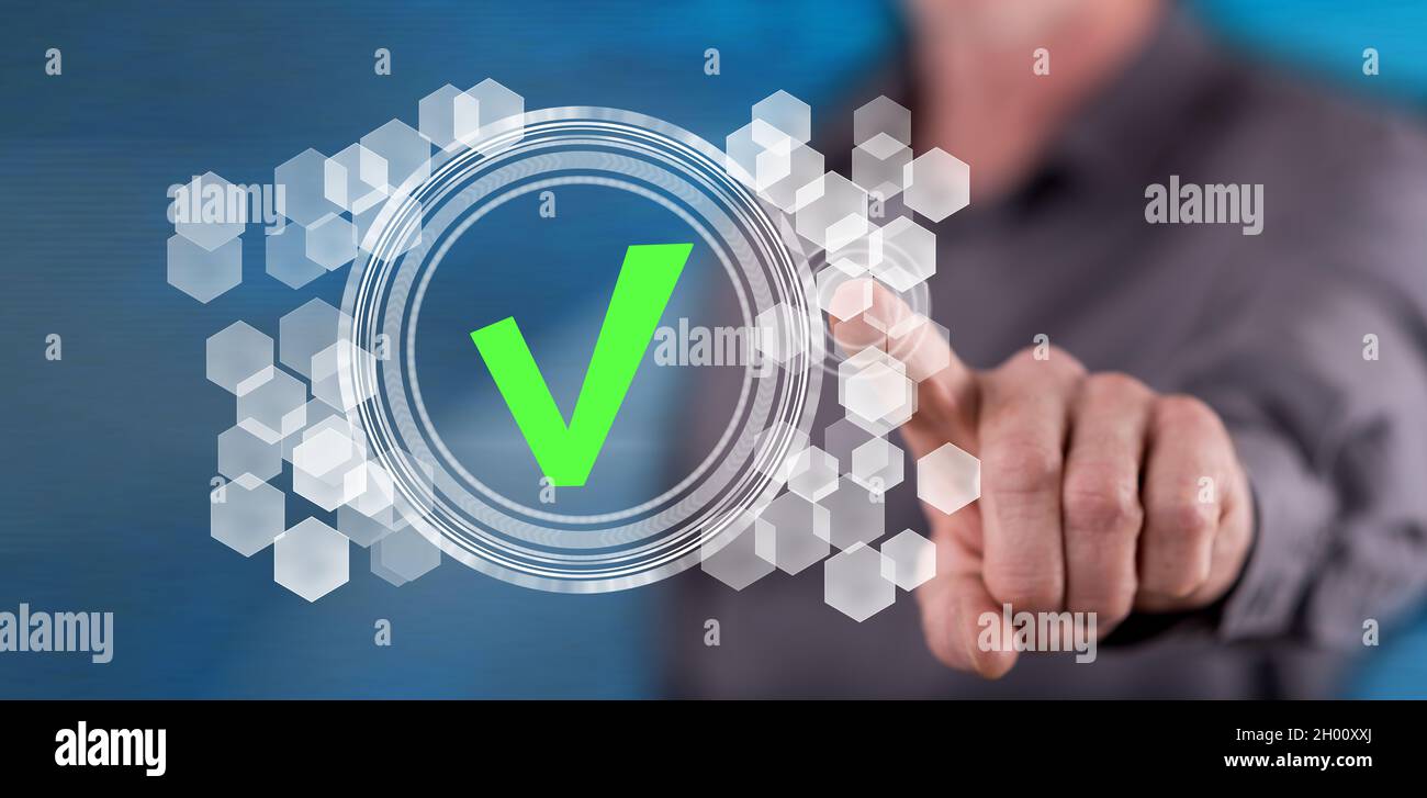 Man touching a validation process concept on a touch screen with his ...