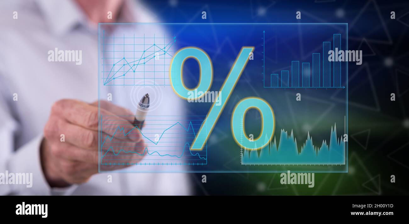 Man touching digital interest rates data on a touch screen with a pen ...