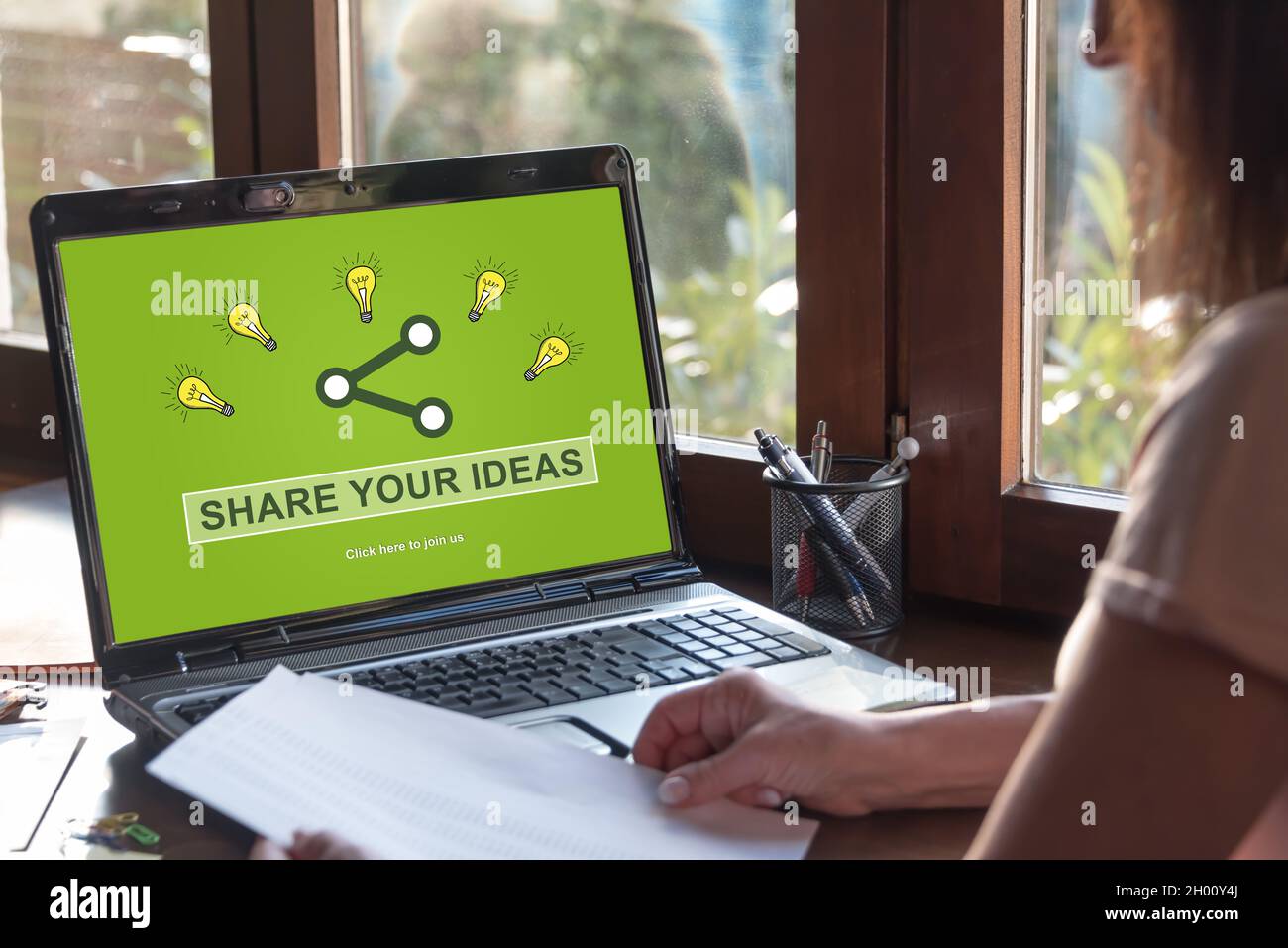 Laptop screen displaying an ideas sharing concept Stock Photo - Alamy