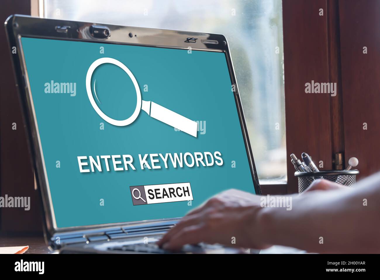 Laptop screen displaying a keywords search concept Stock Photo - Alamy