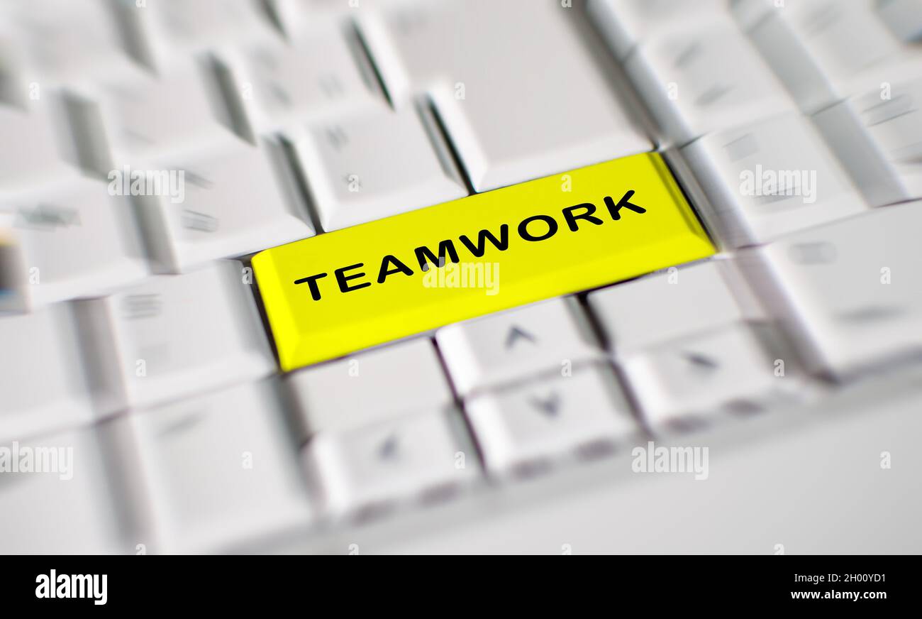 Word teamwork printed on a yellow computer keyboard key Stock Photo - Alamy