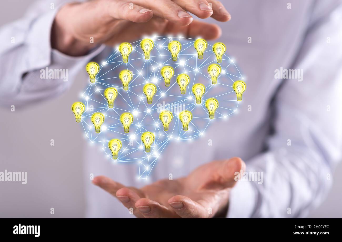 Creative concept between hands of a man in background Stock Photo - Alamy