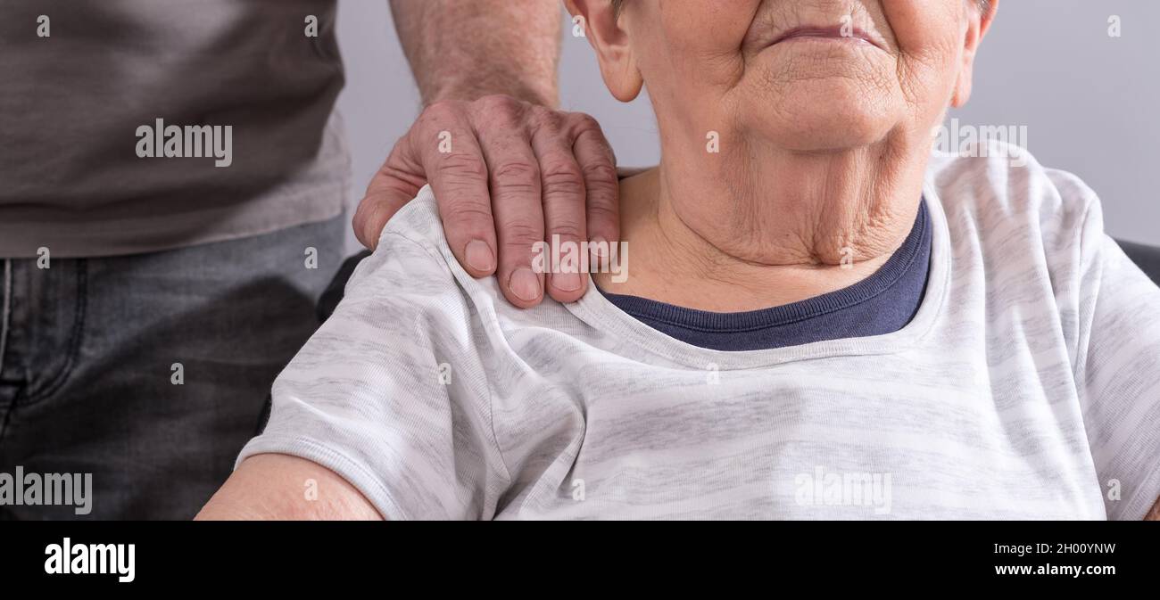 Hand on shoulder of an old woman Stock Photo - Alamy