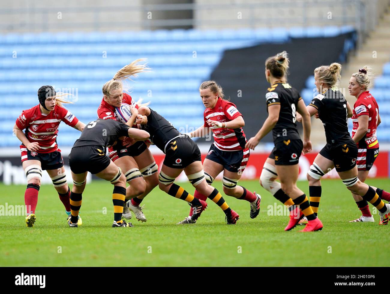 Gloucester-Hartpury's Zoe Aldcroft (third left) is tackled by Wasps ...