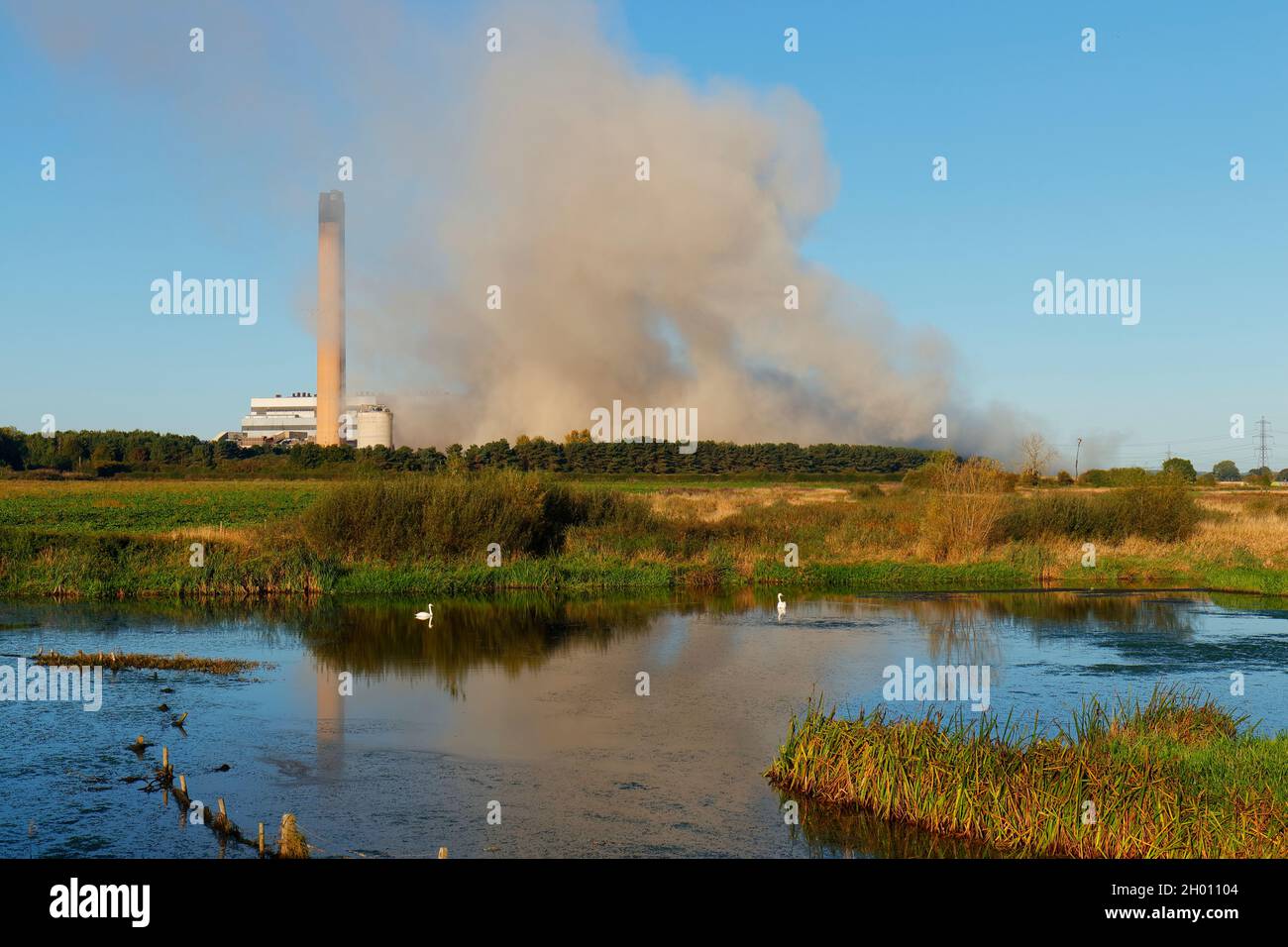 A dust cloud caused by the demolition of 4 remaining cooling towers at ...