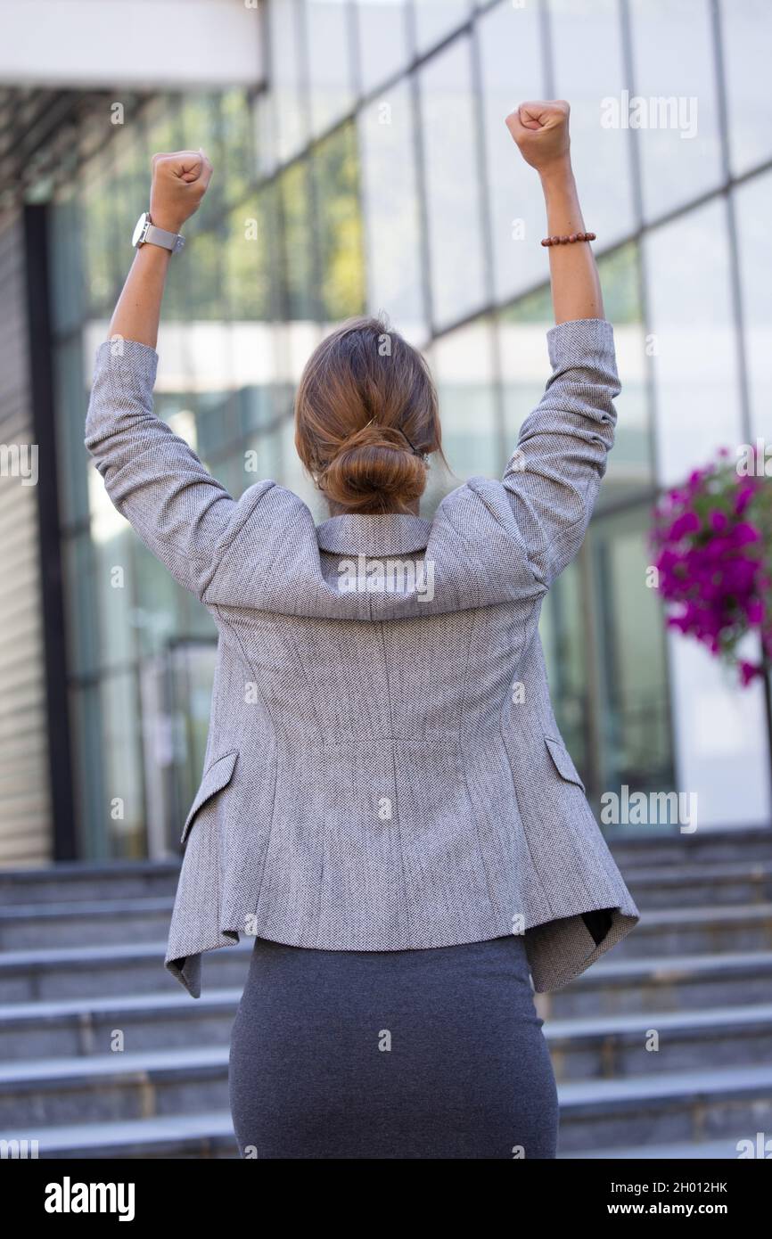 Woman fist raised rear view hi-res stock photography and images - Alamy