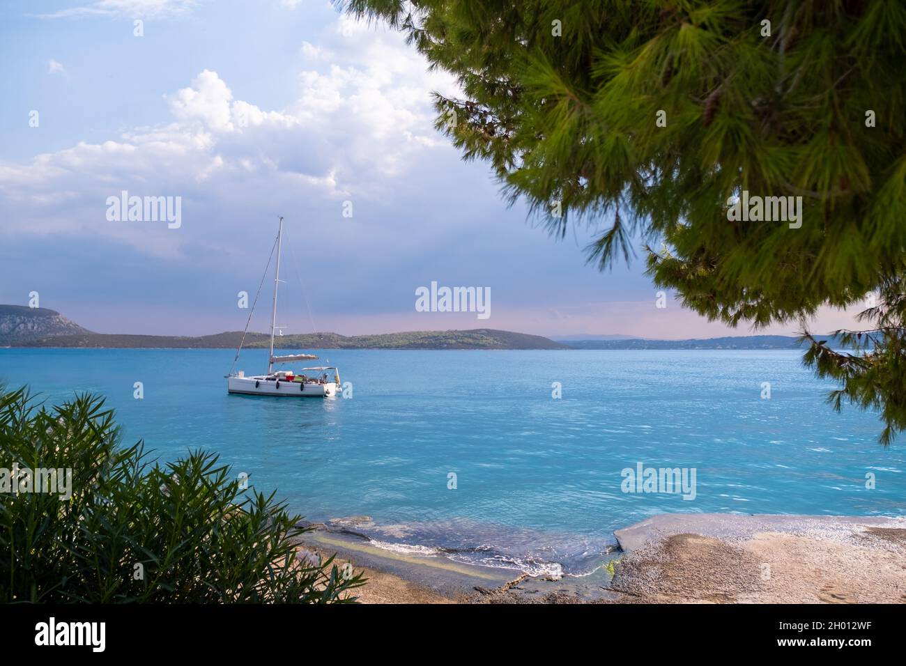 Catamaran sail Yacht cruising on deep blue sea water Stock Photo - Alamy