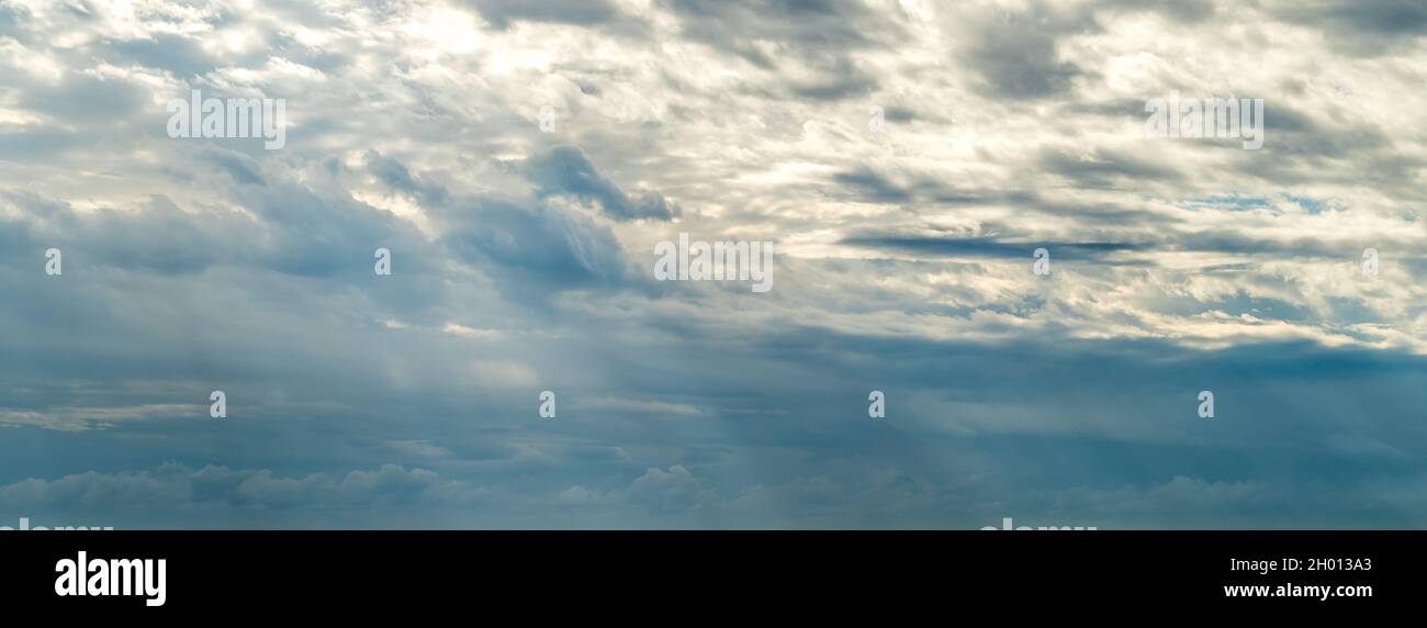 View of Dense Clouds Covering the Skies with Sun Rays peaking through ...