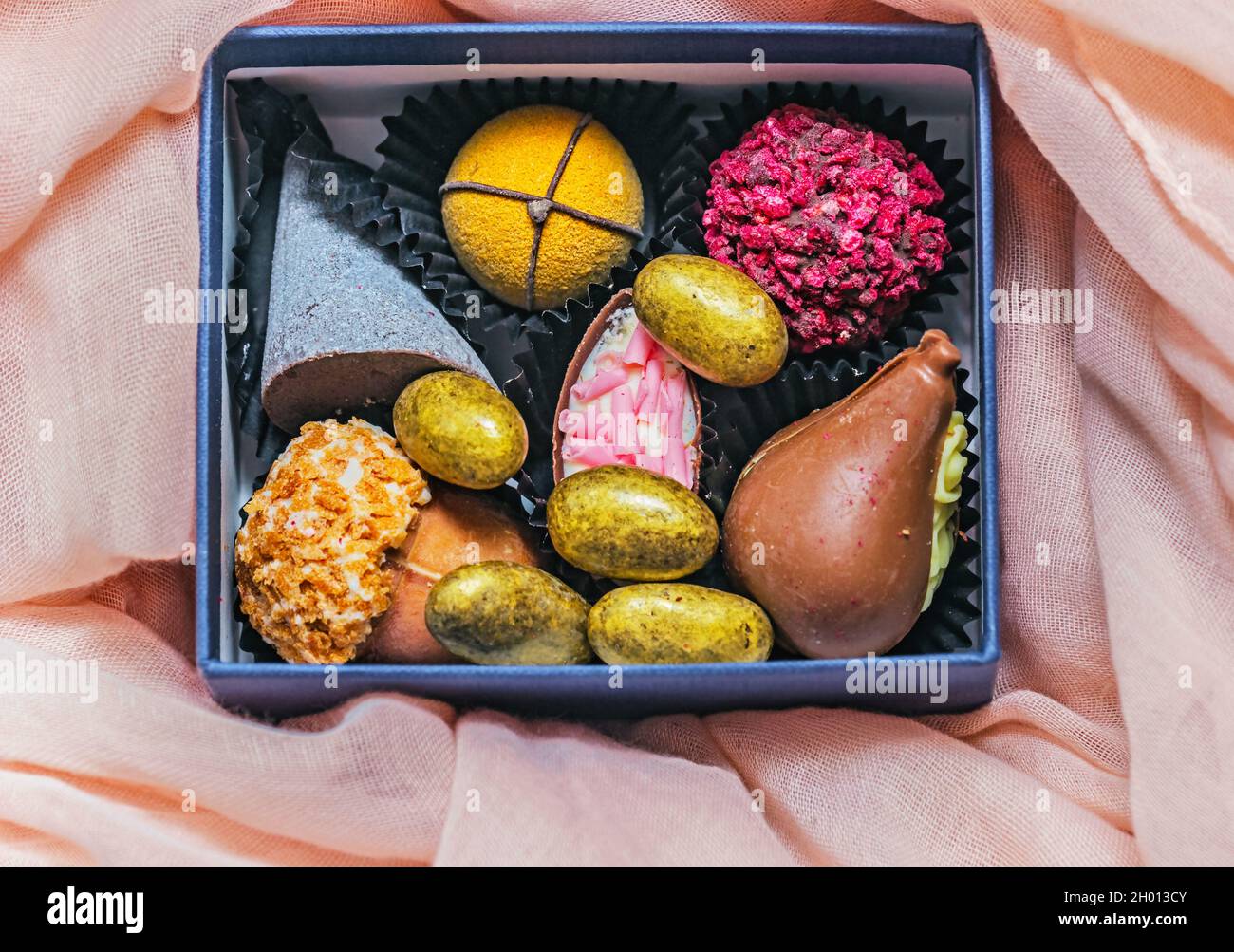 Real fresh colorful designer chocolates in box for good mood Stock ...