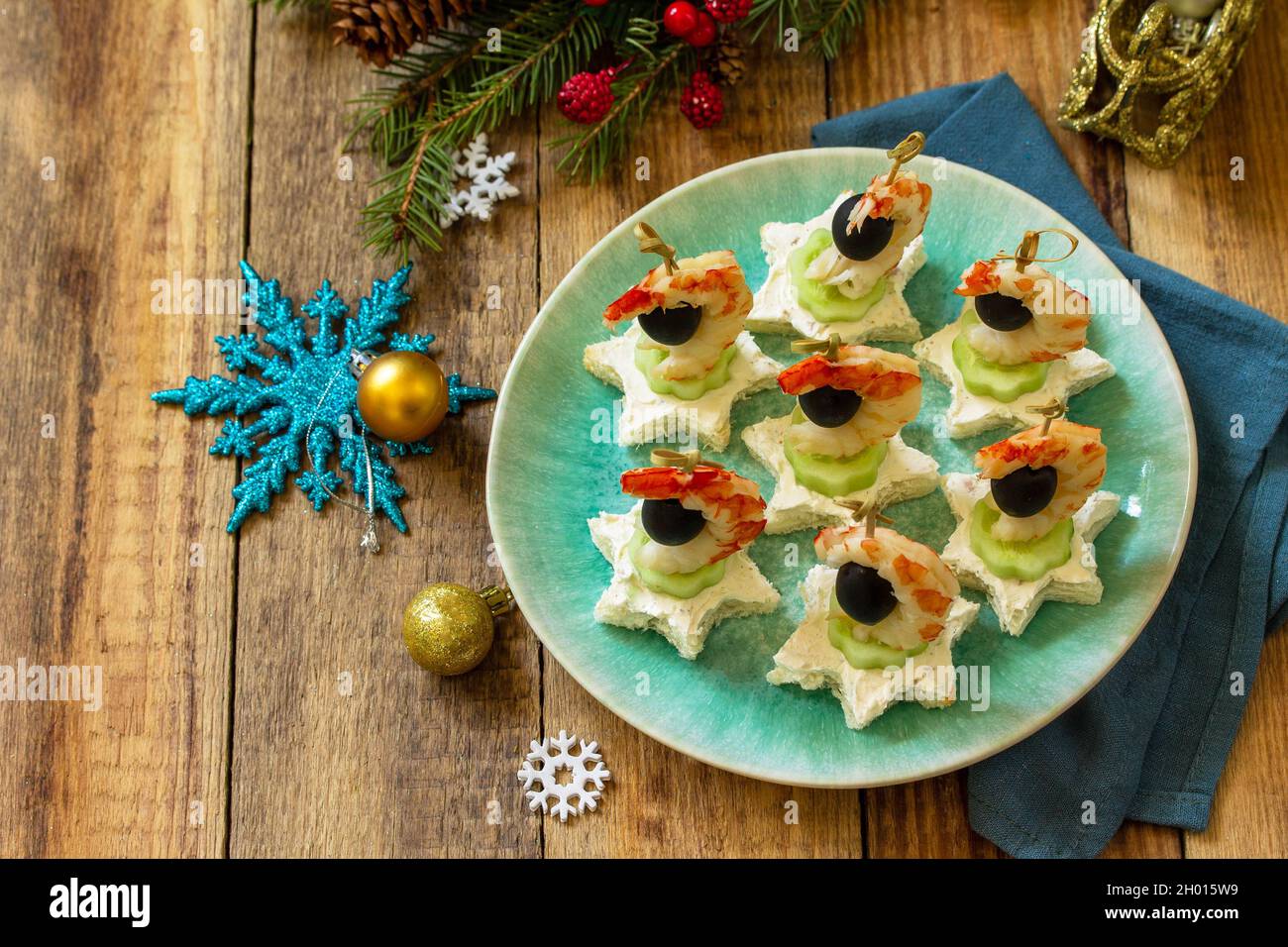 Festive snack of canapes on the Christmas table. Canapes with cheese ...