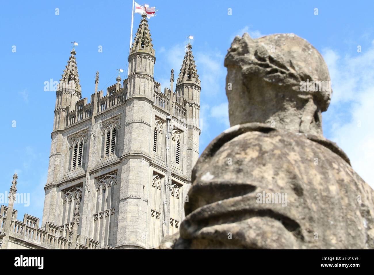 A back view of a Roman soldier statue overlooking The Roman Baths ...