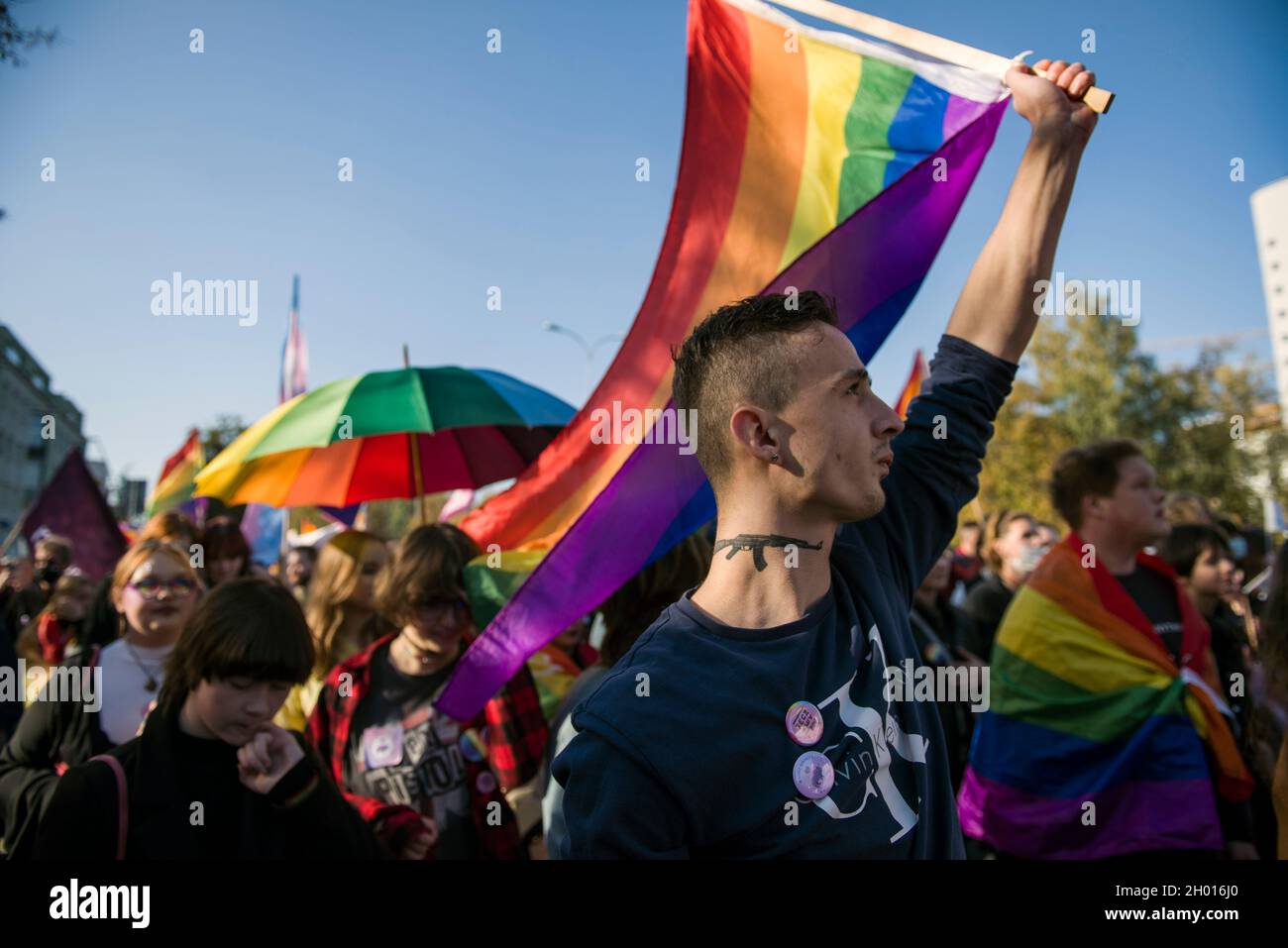 Participant waving rainbow flag hi-res stock photography and images - Alamy