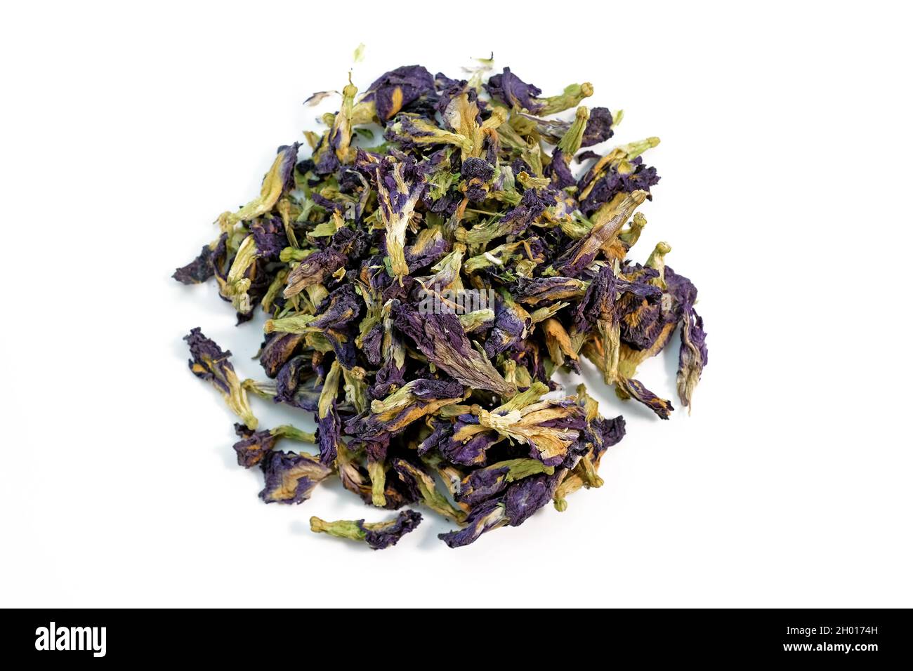 Anchan dry on a white background top view. Anchan, also known as blue ...