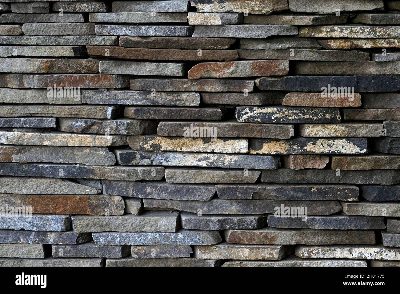 Dark brown rough stone wall. Brick wall stack background. Rock wall ...