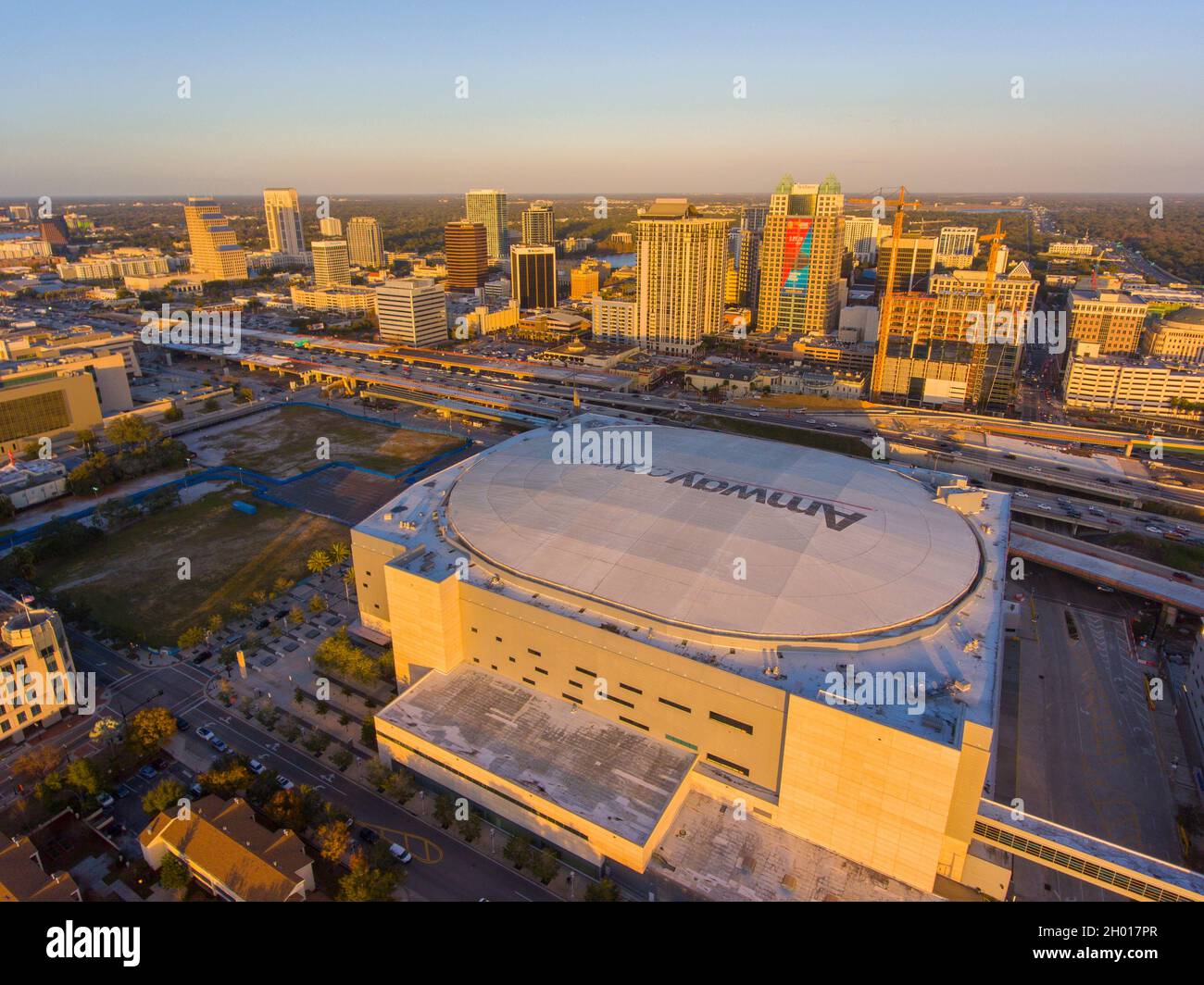 Amway Center aerial view at sunset with Orlando modern business ...