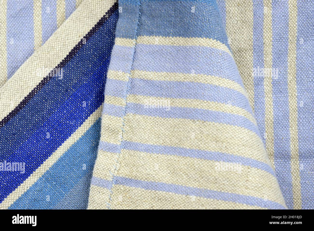 Gray linen fabric with a thin lilac strip, background. Linen fabric ...