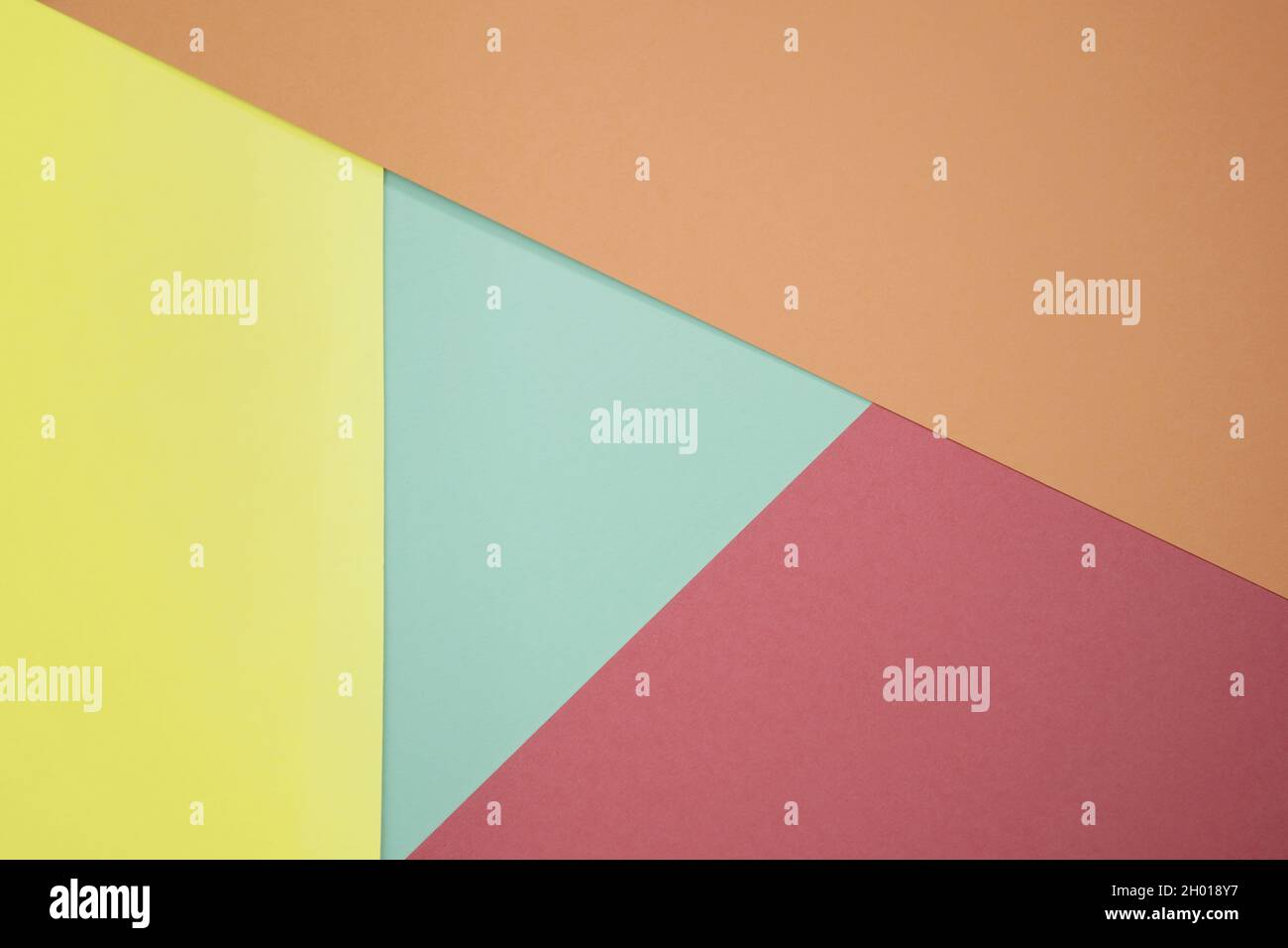 Abstract background from colored paper of red, yellow and green colors ...
