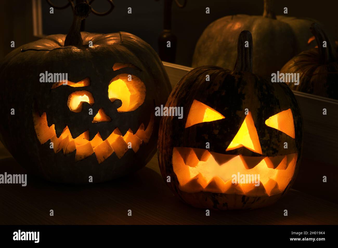 Halloween pumpkin smile and scary eyes for party night with reflection ...