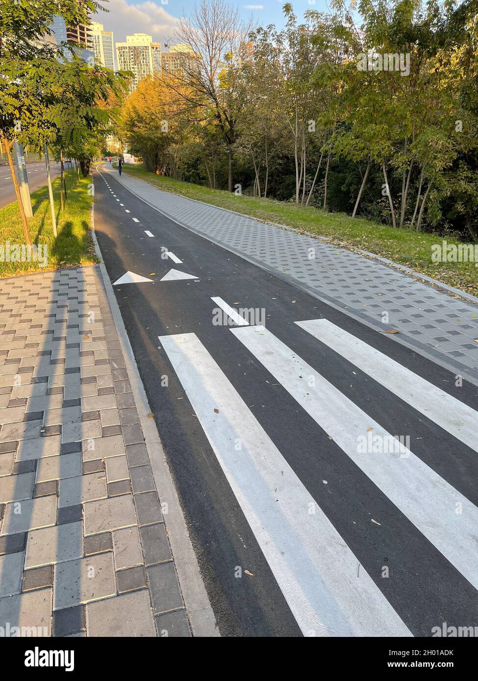 Cycling lane with pedestrian crosswalk on the sidewalk Stock Photo - Alamy
