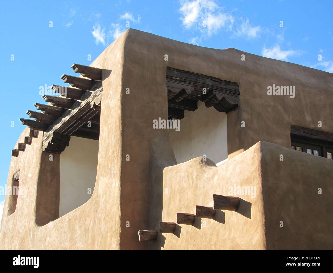 Section of an adobe building with intricate architectural details Stock ...