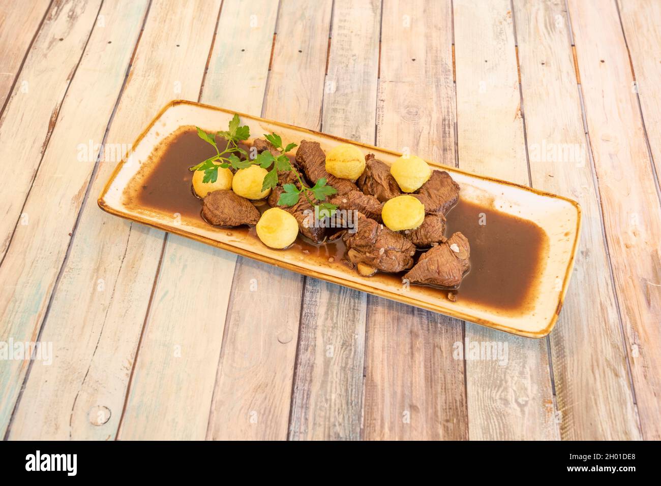 Beef sirloin tacos stew with new potatoes, parsley and sea salt flakes ...