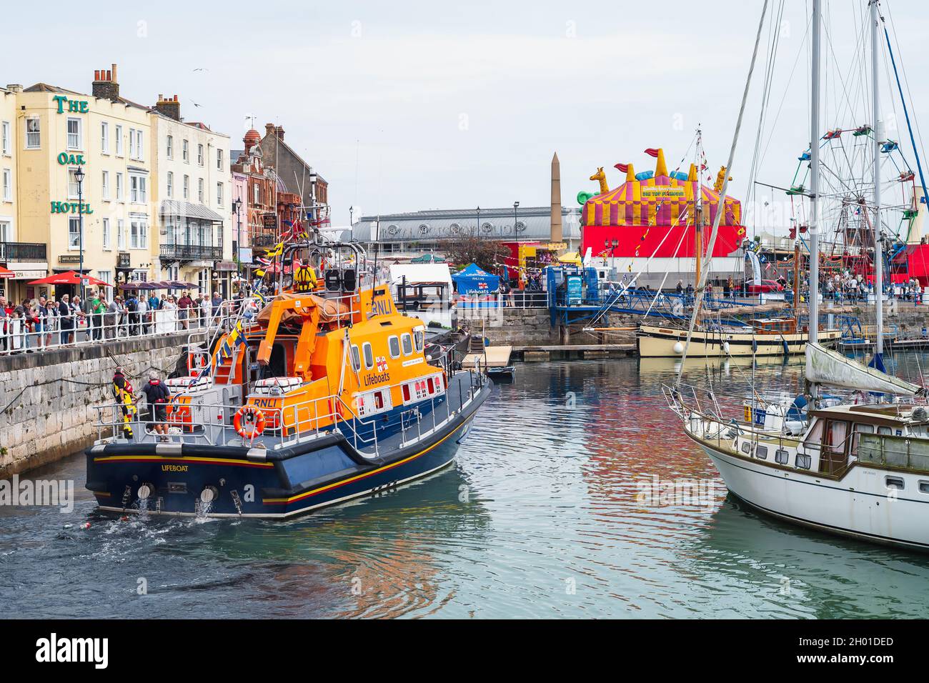 Ramsgate, UK - Sep 26 2021 A lifeboat and fun fair in the habour during ...