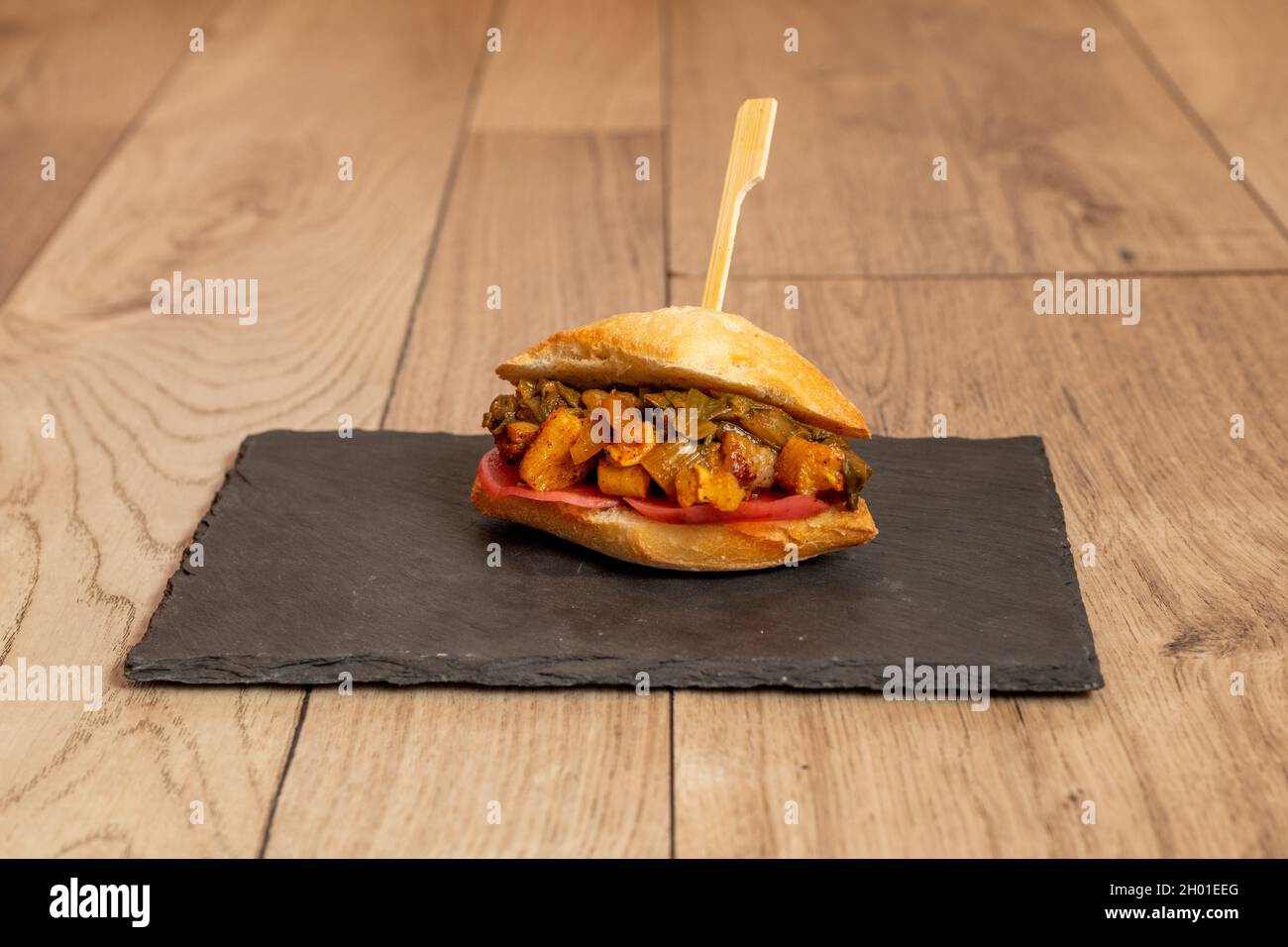 Crispy ear sandwich and vegetables with tomato on village bread Stock ...