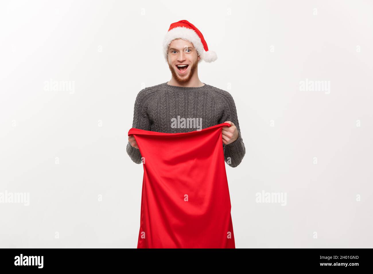 Christmas concept - Young beard handsome man exciting open santa big ...