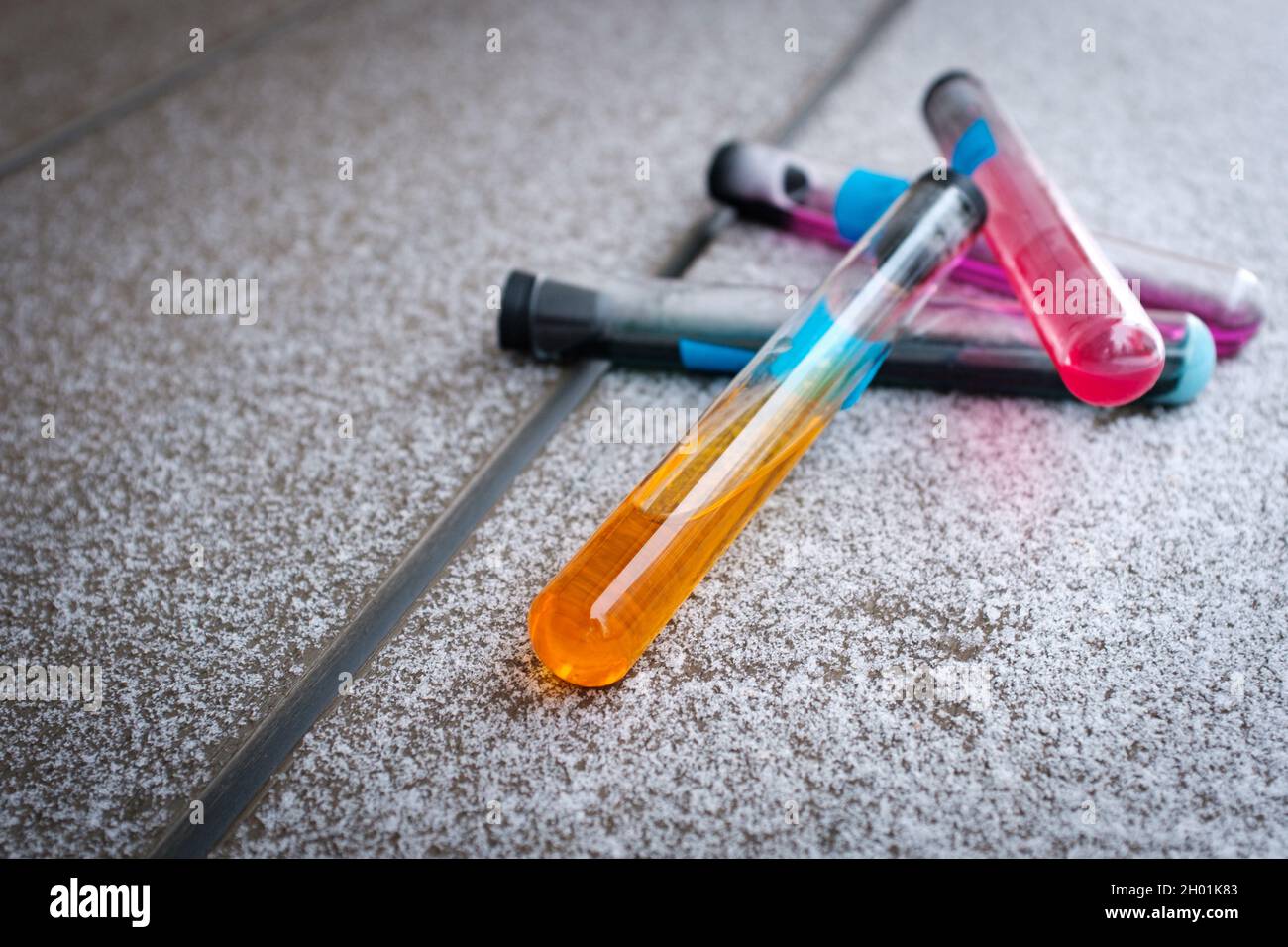 Colorful test tubes, yellow, pink and purple. Chemistry experiment ...