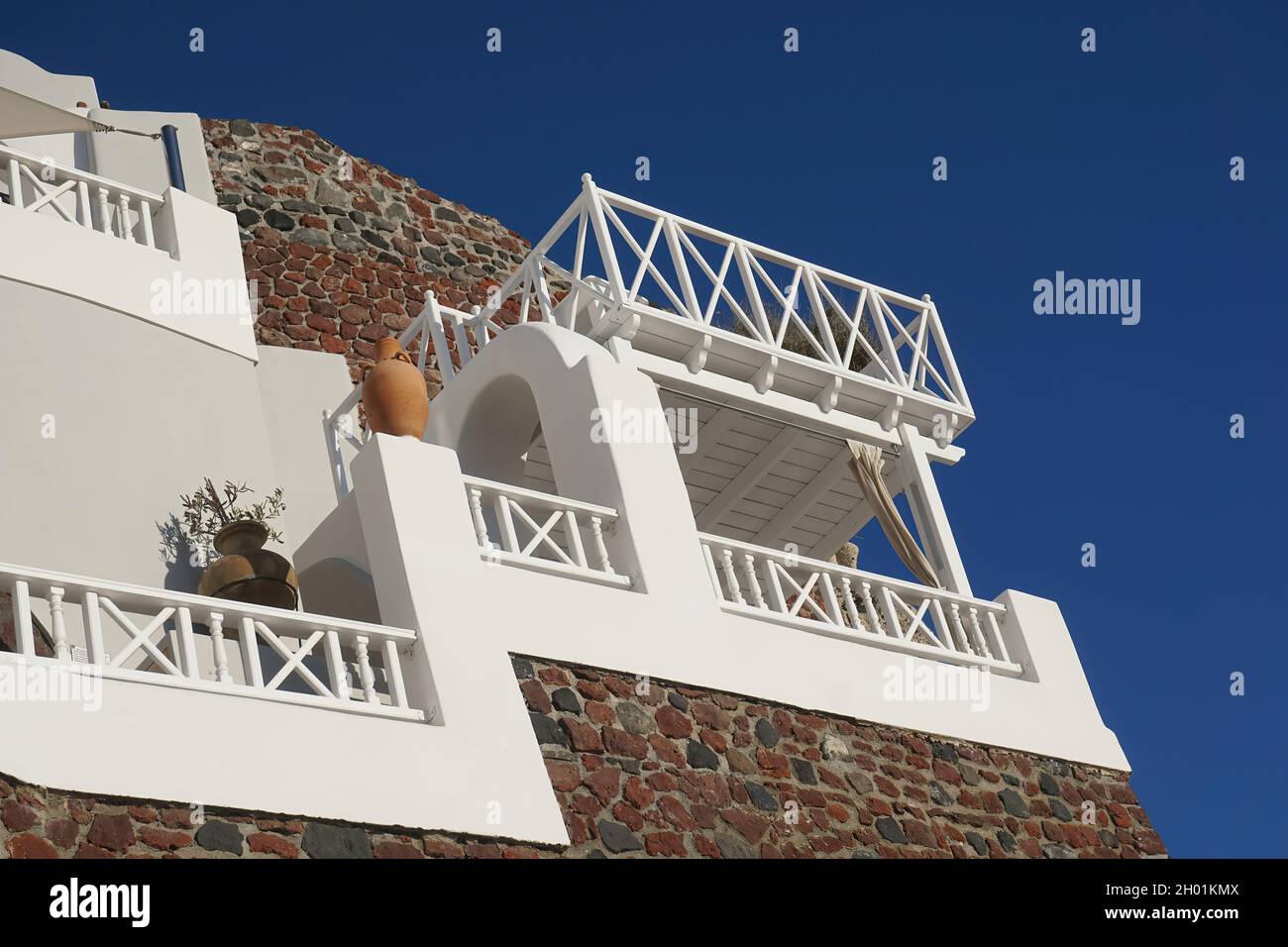 Balconies on the cliff-side overlook the caldera and Santorini's famed ...