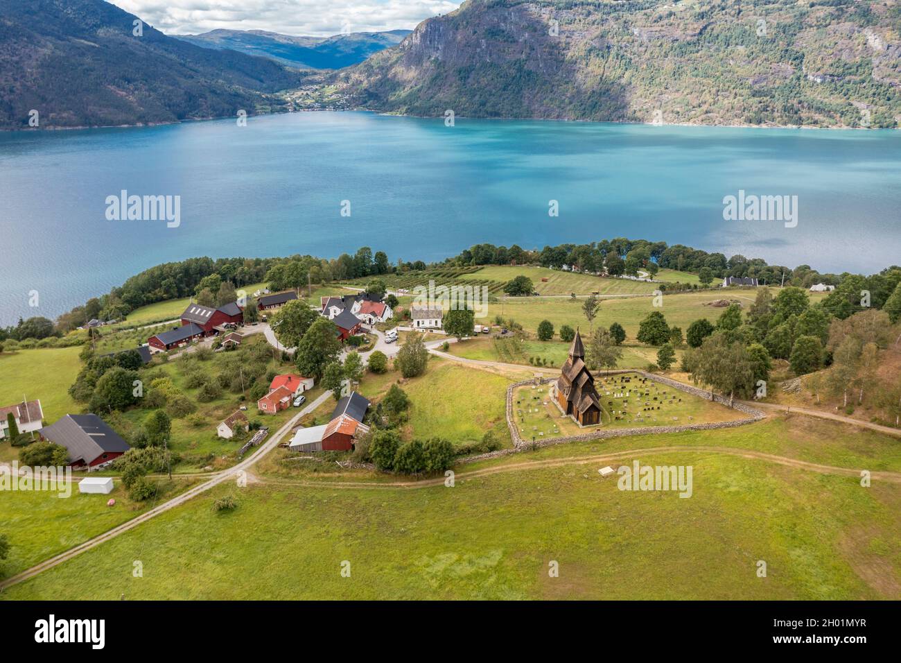 Aerial view of Urnes stave church at the Lustrafjord, inner branch of ...