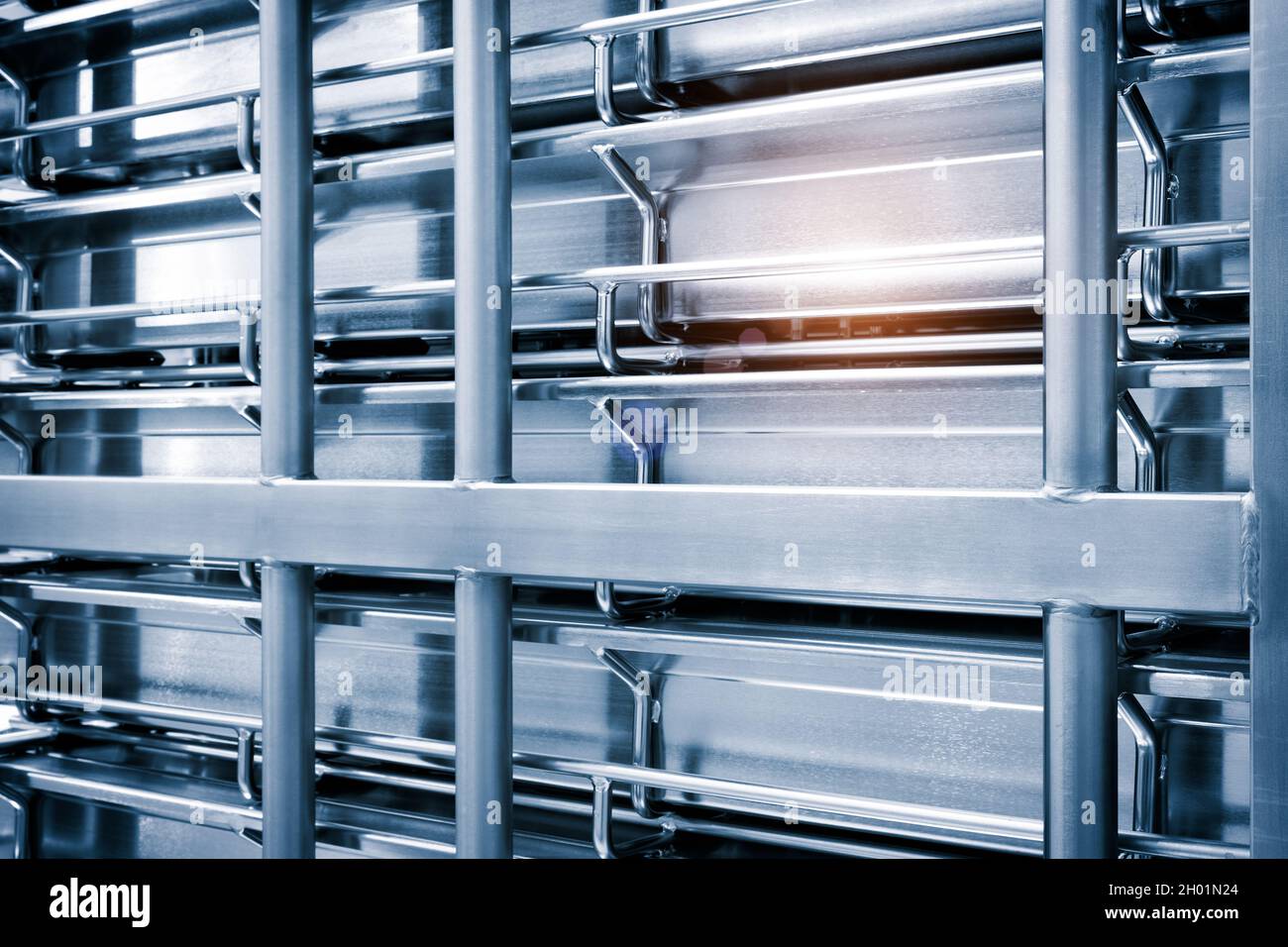 Rack with metal containers for cooking food Stock Photo - Alamy