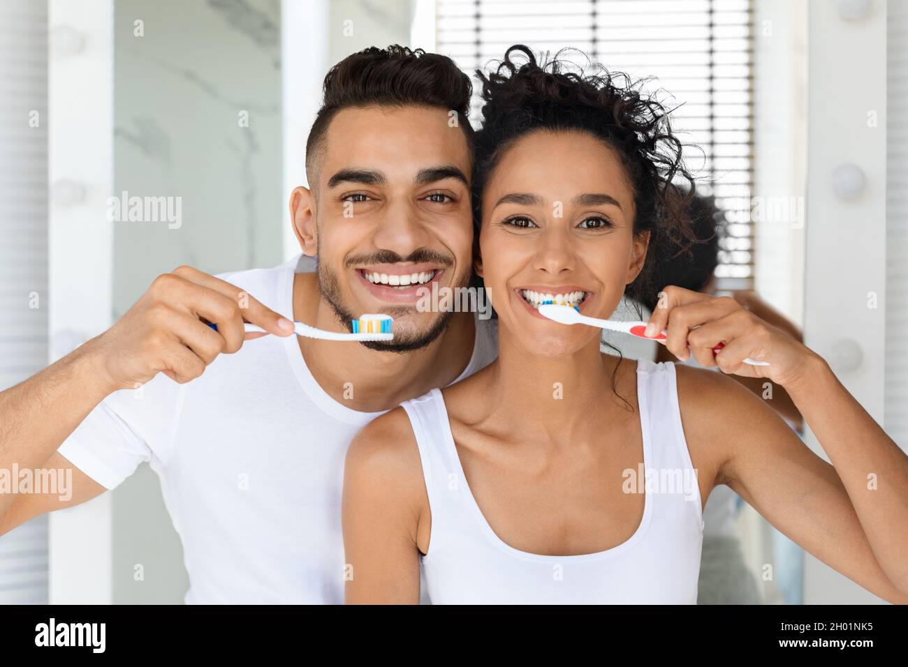 Portrait Of Cheerful Young Middle Eastern Couple Brushing Teeth ...