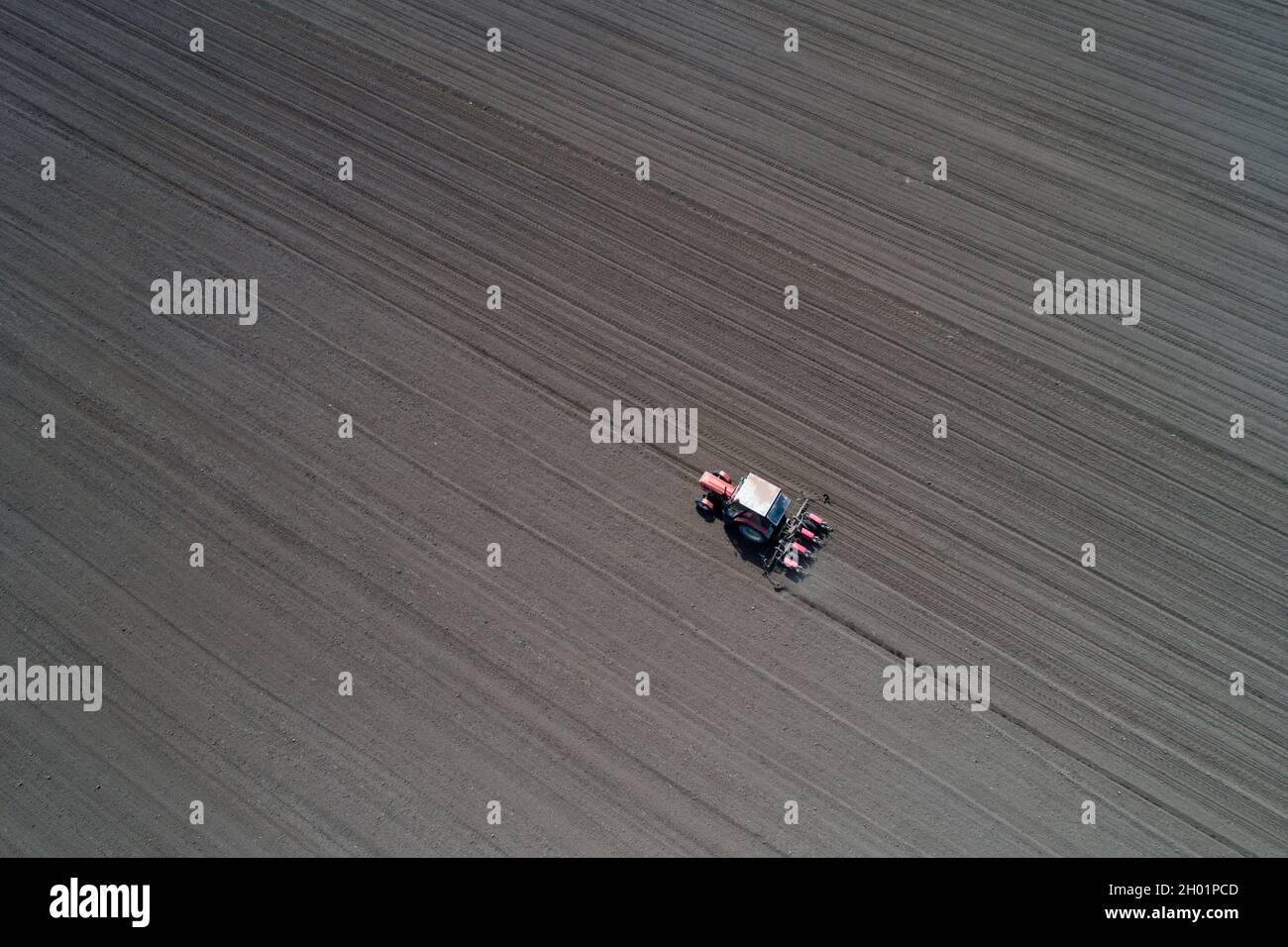 Tractor Harrowing Field In Spring High Resolution Stock Photography and ...