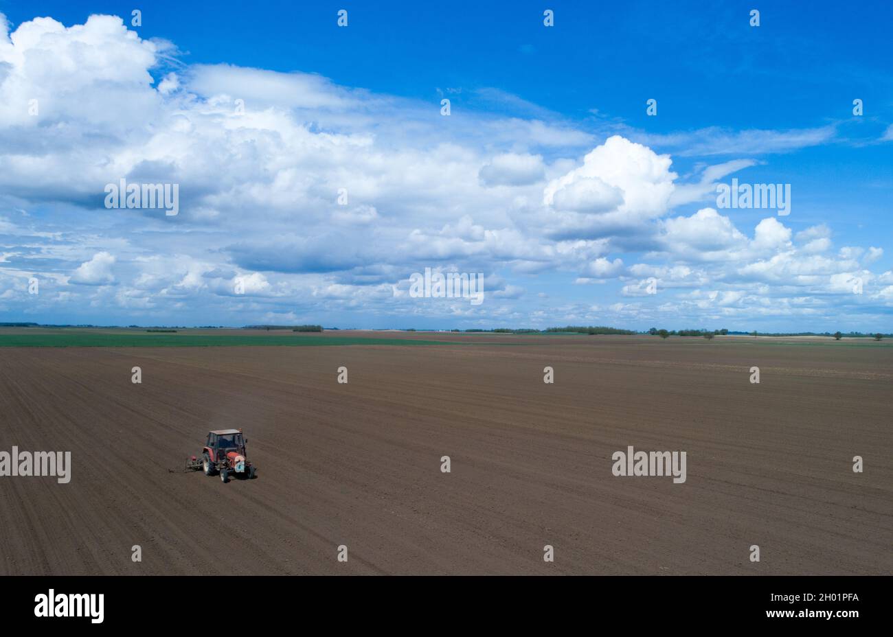 Tractor Harrowing Field In Spring High Resolution Stock Photography and ...