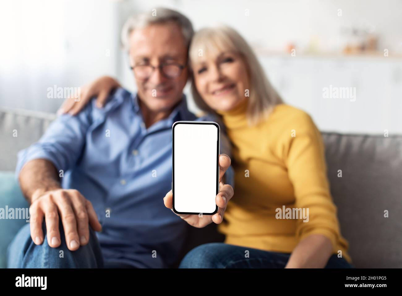 Elderly Couple Showing Phone Empty Screen To Camera Advertising Mobile ...
