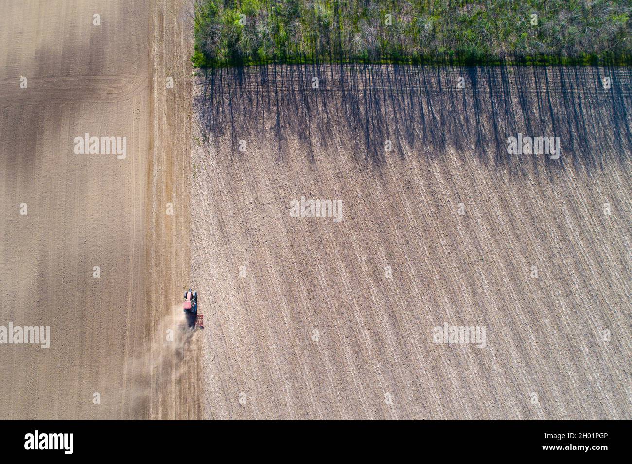 Tractor Harrowing Field In Spring High Resolution Stock Photography and ...